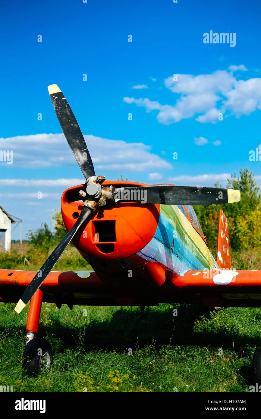 Colorful airplane on the grass of the airfield Stock Photo - Alamy