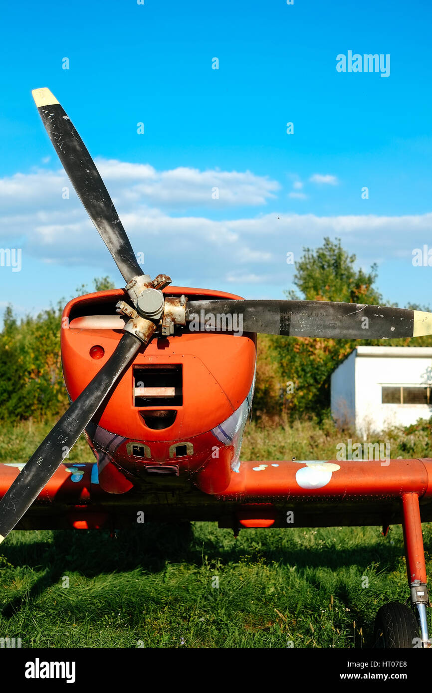 Colorful airplane on the grass of the airfield Stock Photo - Alamy
