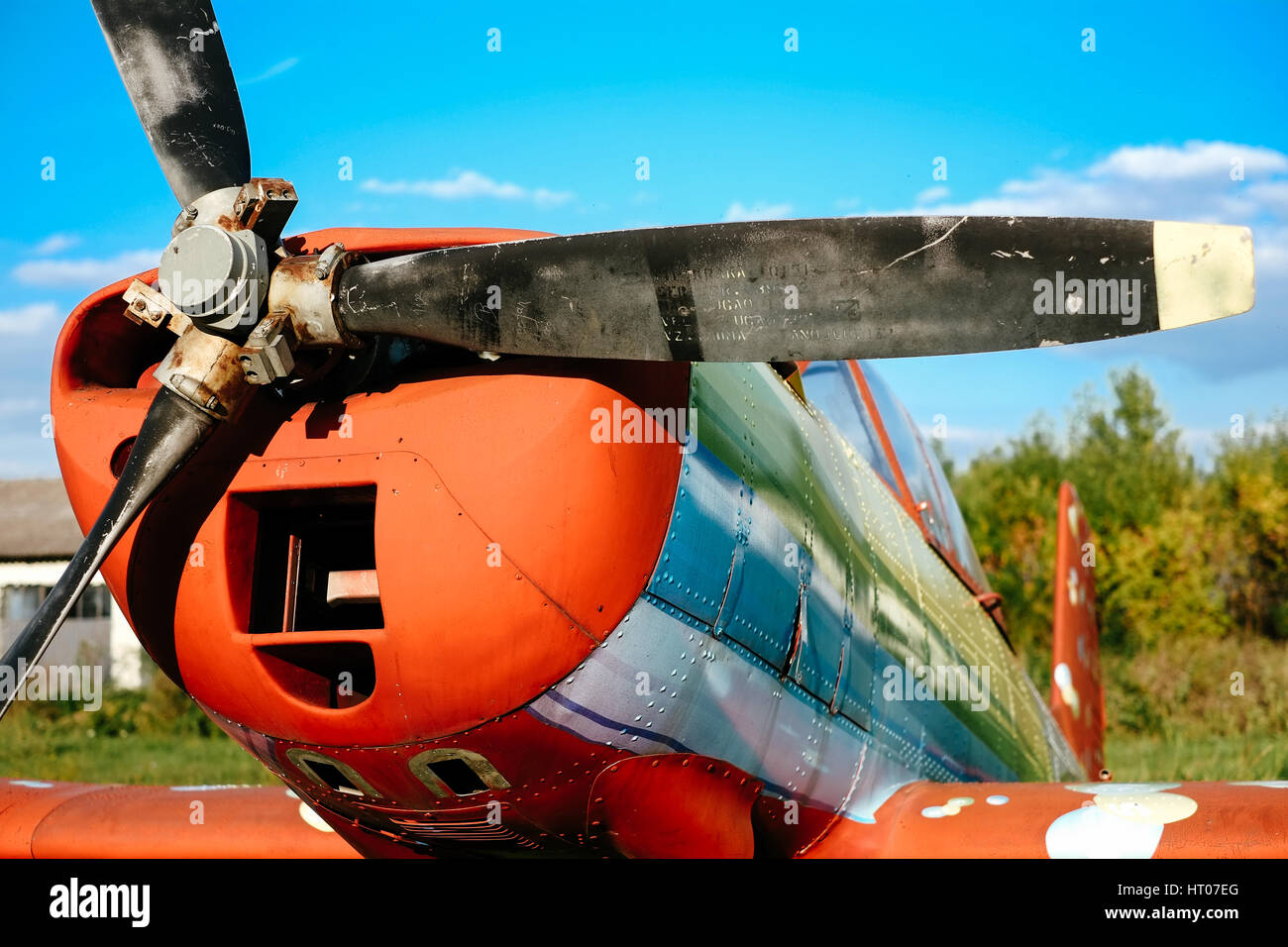 Colorful airplane on the grass of the airfield Stock Photo - Alamy