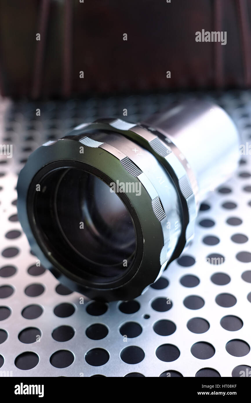 Professional projector lens on metalic background Stock Photo - Alamy