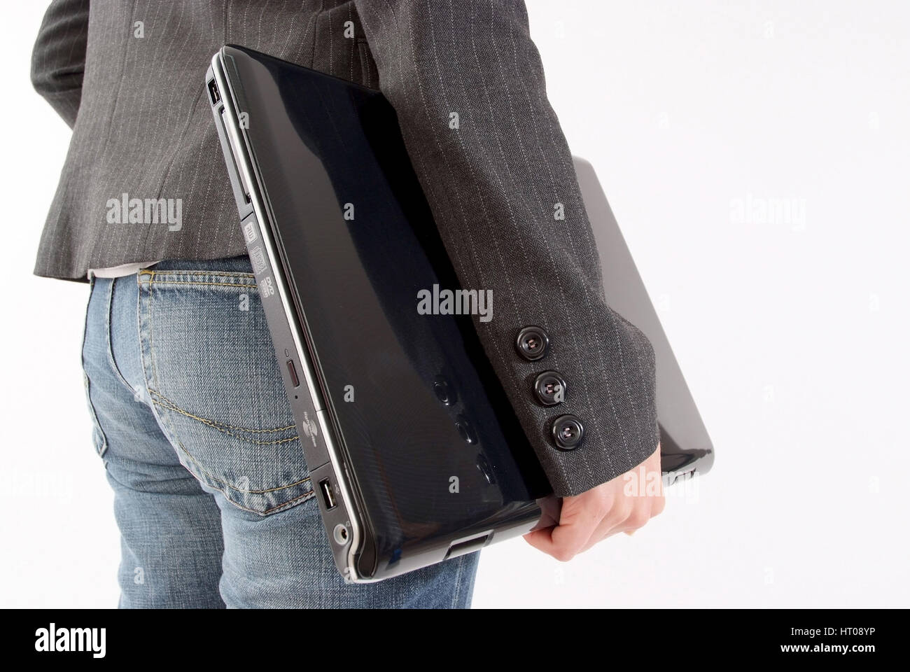 Notebook unter dem Arm - carry laptop under arm Stock Photo - Alamy