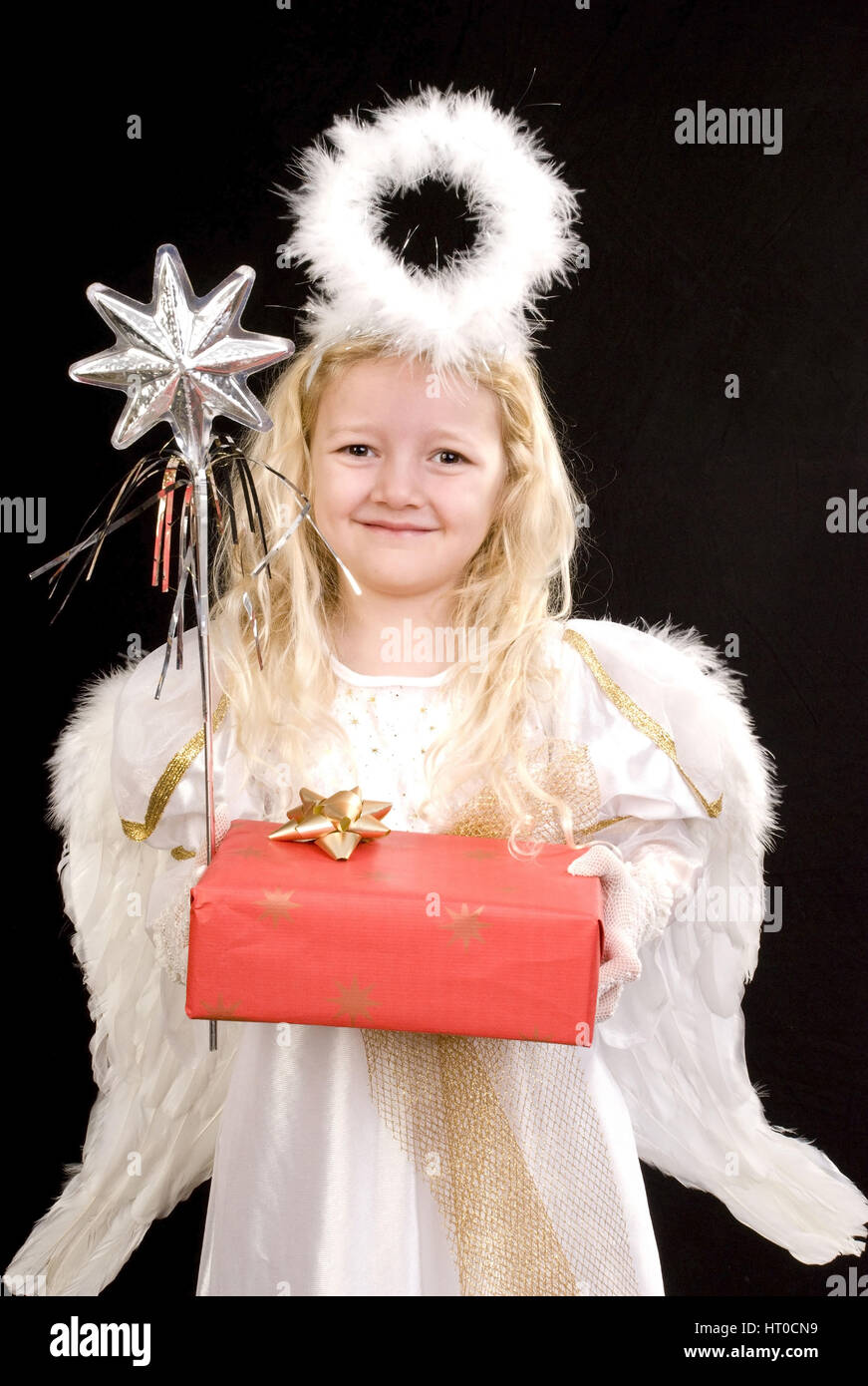 Christkind mit Weihnachtsgeschenk - christ child with presents Stock ...