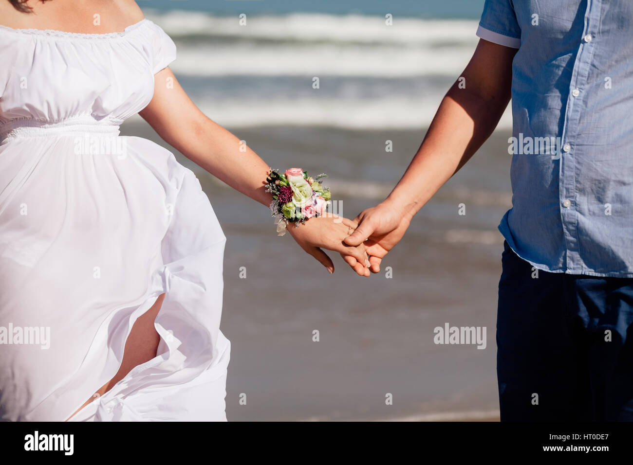lovely couple holding hands together. Close up shot Stock Photo - Alamy