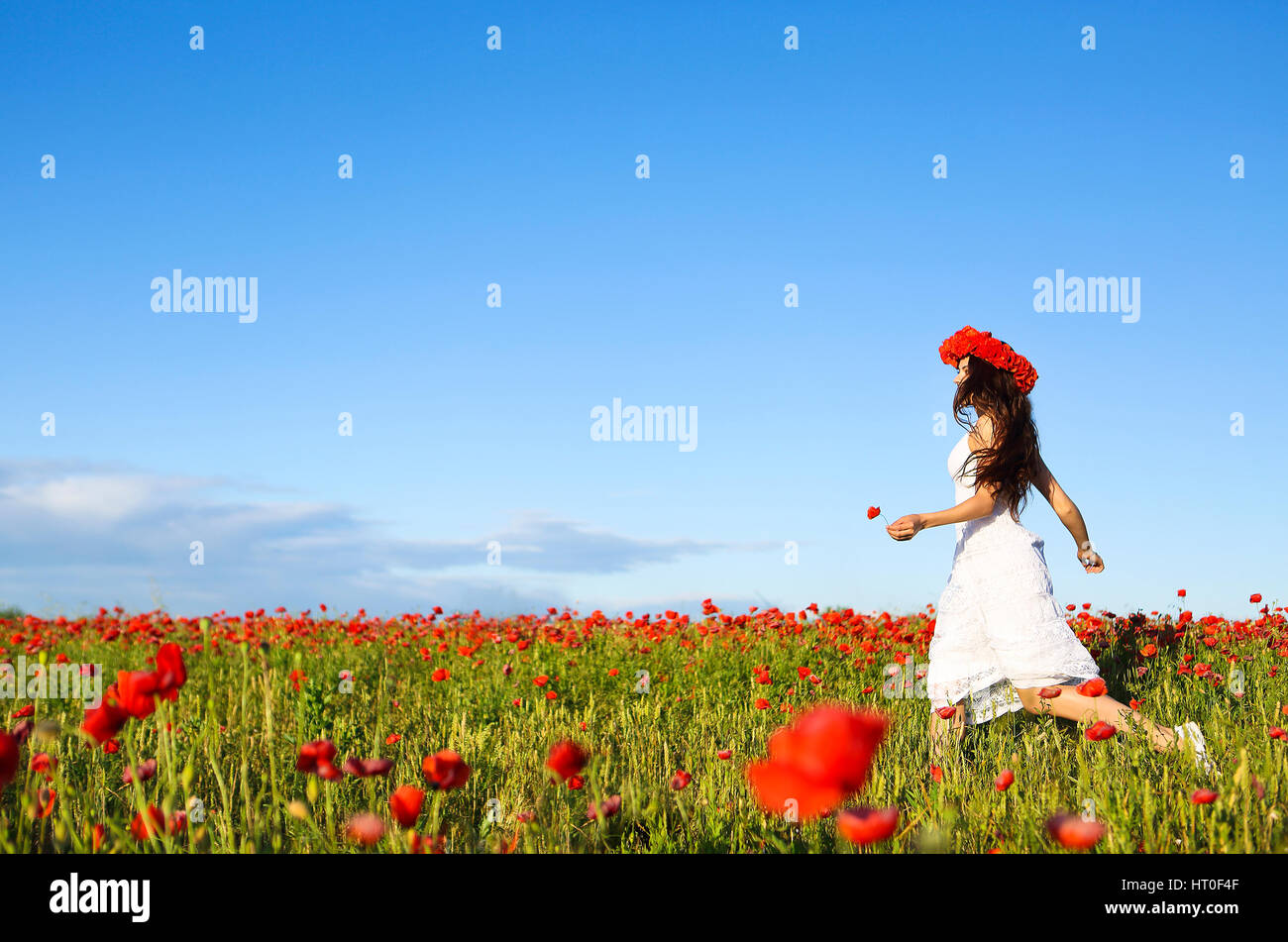 Girl Running In Field Of Flowers