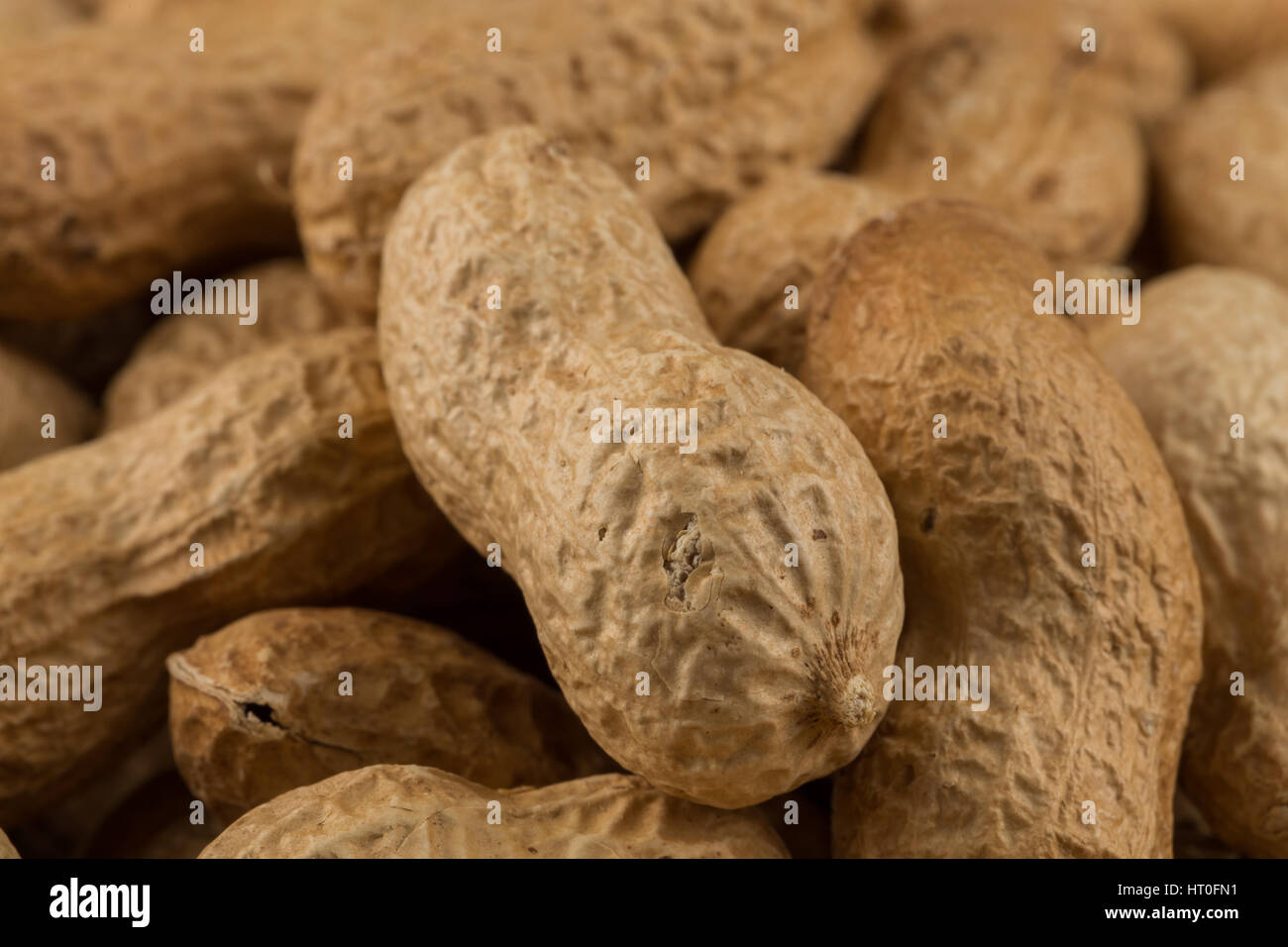 Pile of peanuts shells close up for background Stock Photo - Alamy