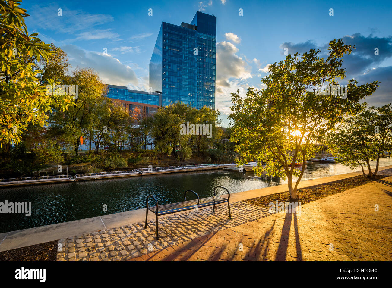 The Waterfront Promenade and modern building at sunset, in Harbor East ...