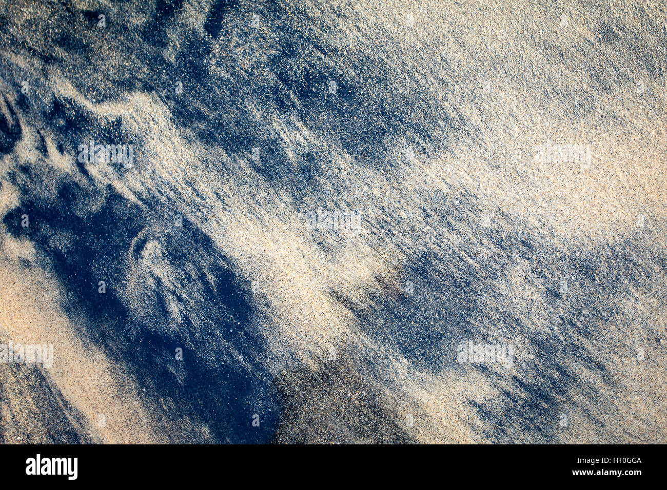 Black volcanic sand on the beach with a quaint pattern, texture and ...