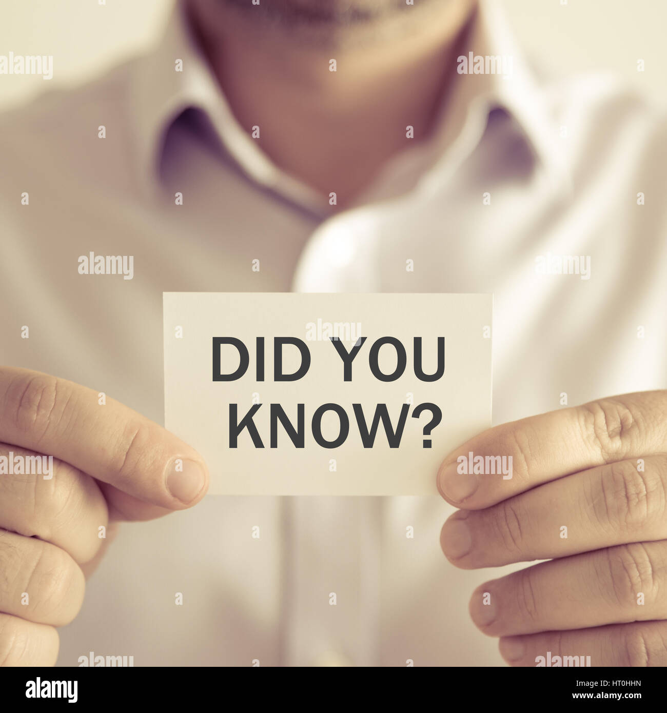 Closeup on businessman holding a card with text DID YOU KNOW ...