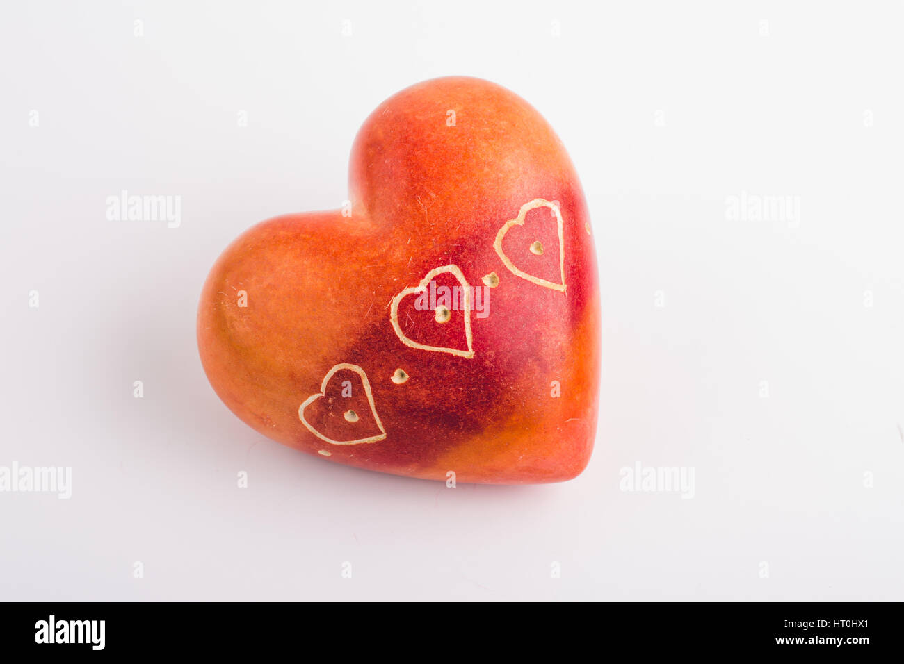 Red Heart Shape Stone. Isolated on a white background Stock Photo - Alamy