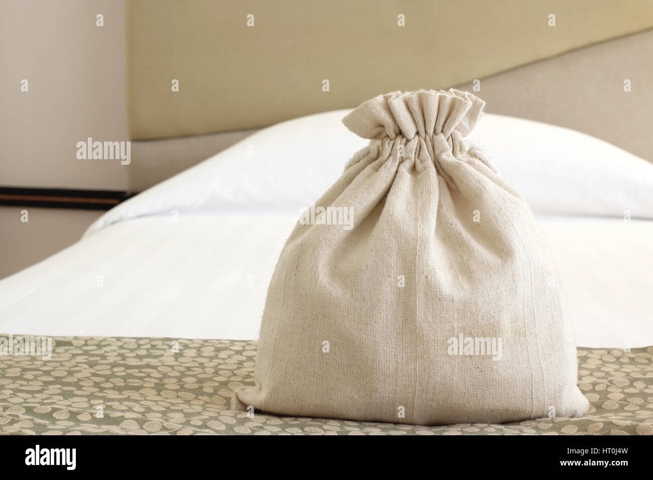 small burlap fabric pouch on the bed Stock Photo - Alamy