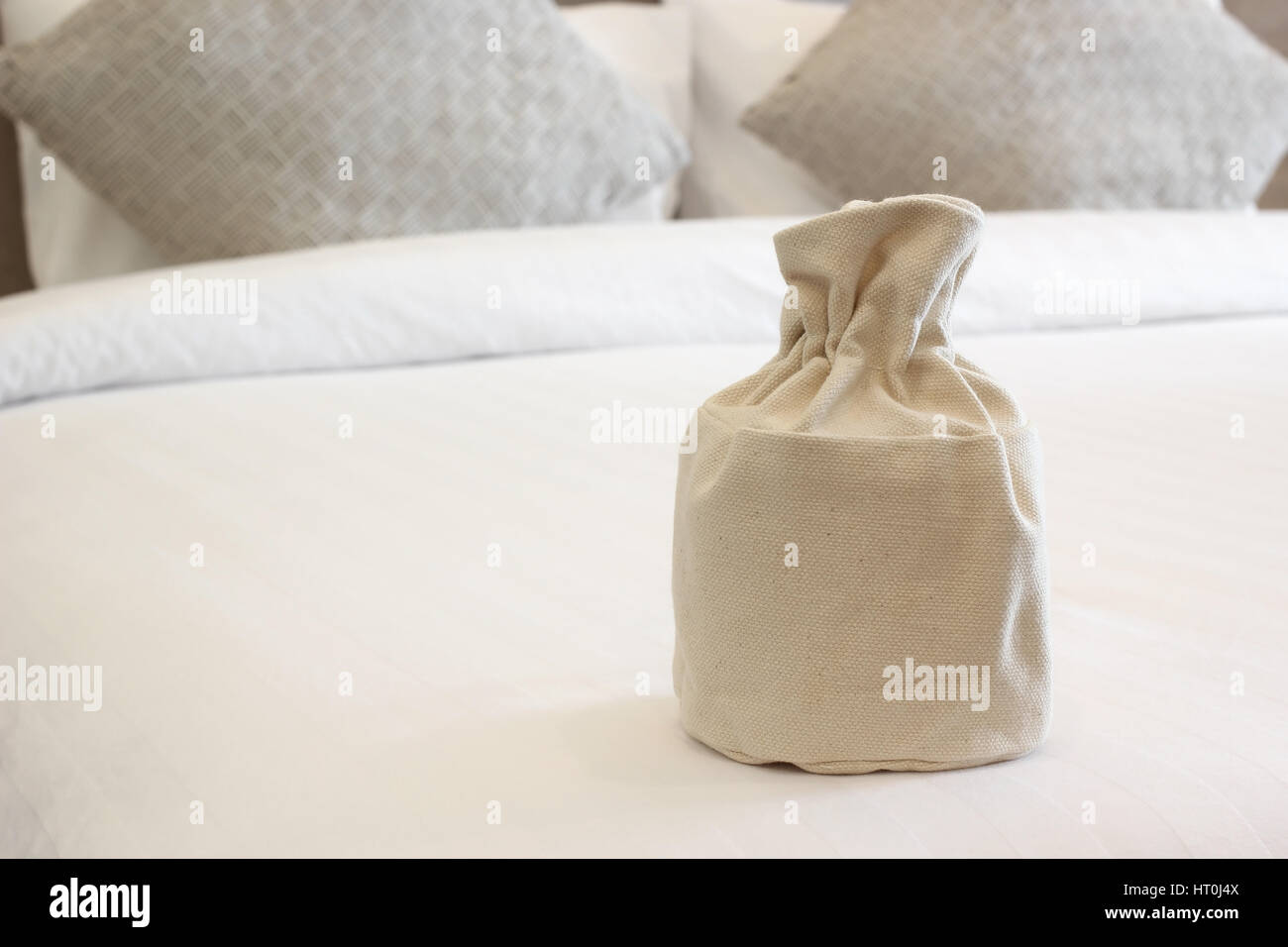 small burlap fabric pouch on the bed Stock Photo - Alamy