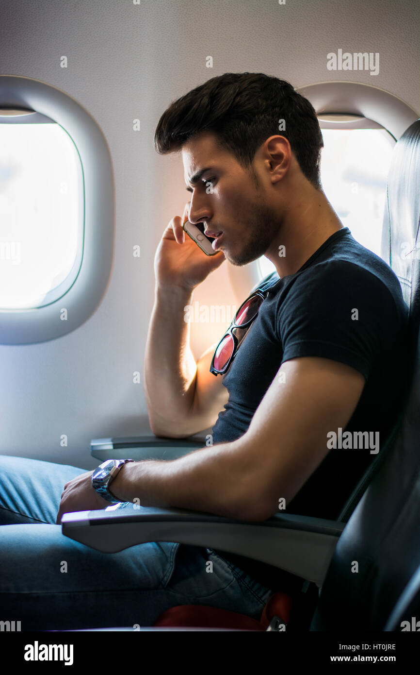 Man sitting on an airplane hi-res stock photography and images - Alamy