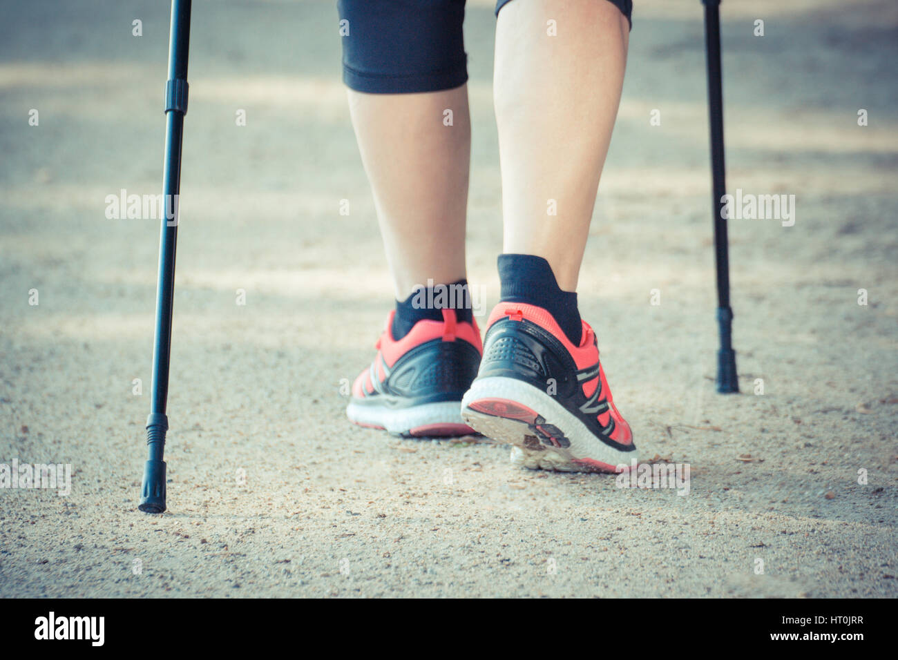Vintage photo, Legs of elderly senior woman in sporty shoes practicing ...