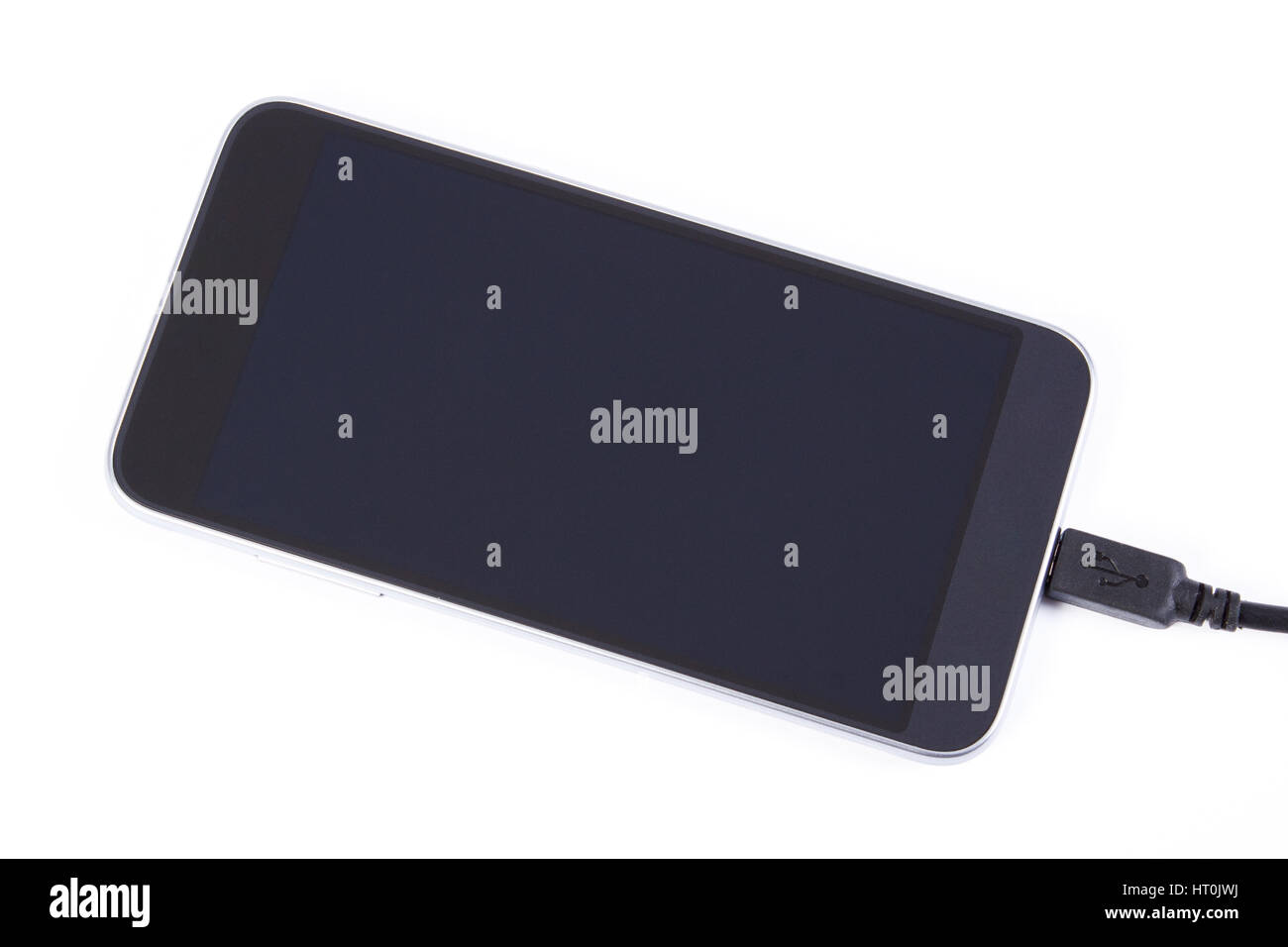 Mobile phone with connected plug of charger, smartphone charging, white ...