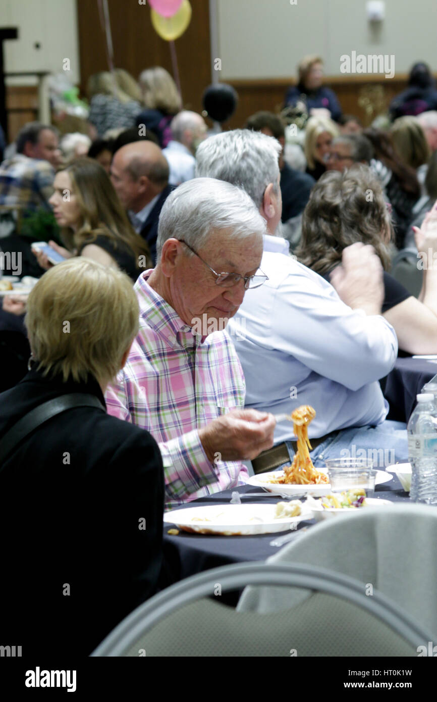 People at spaghetti dinner Stock Photo - Alamy