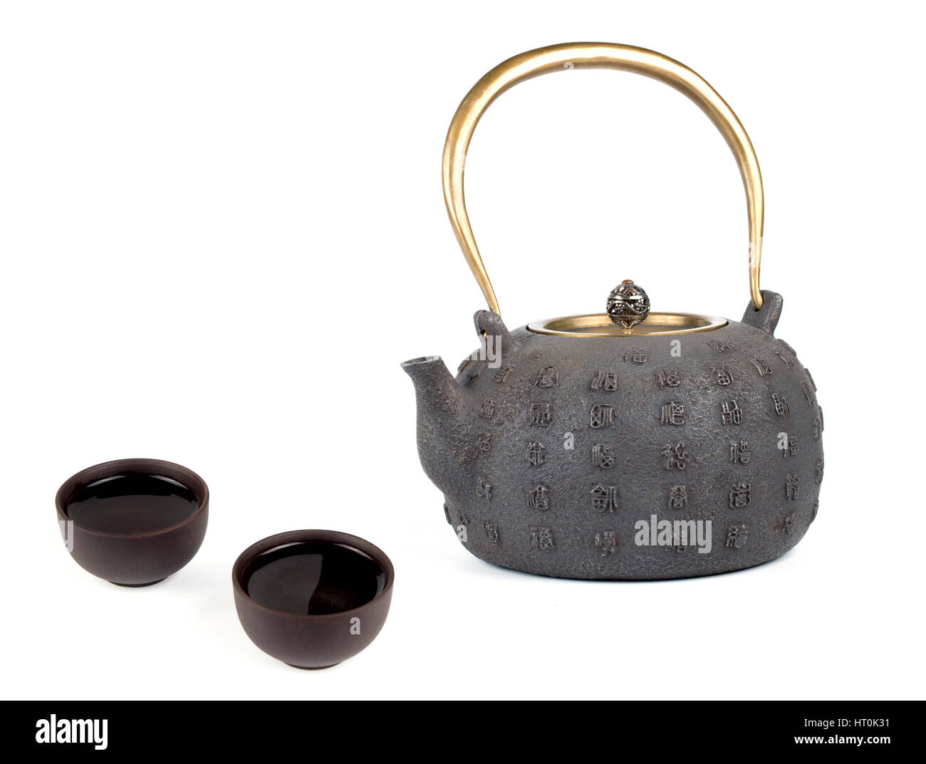 Traditional teapot and cups on the white background Stock Photo - Alamy