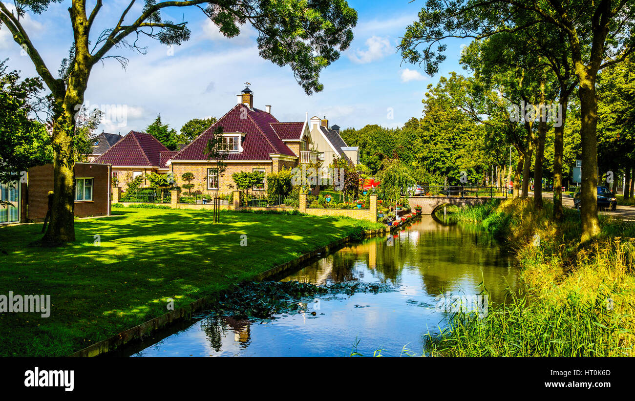 Typical scene of a canal and houses in a Polder in the historic village ...