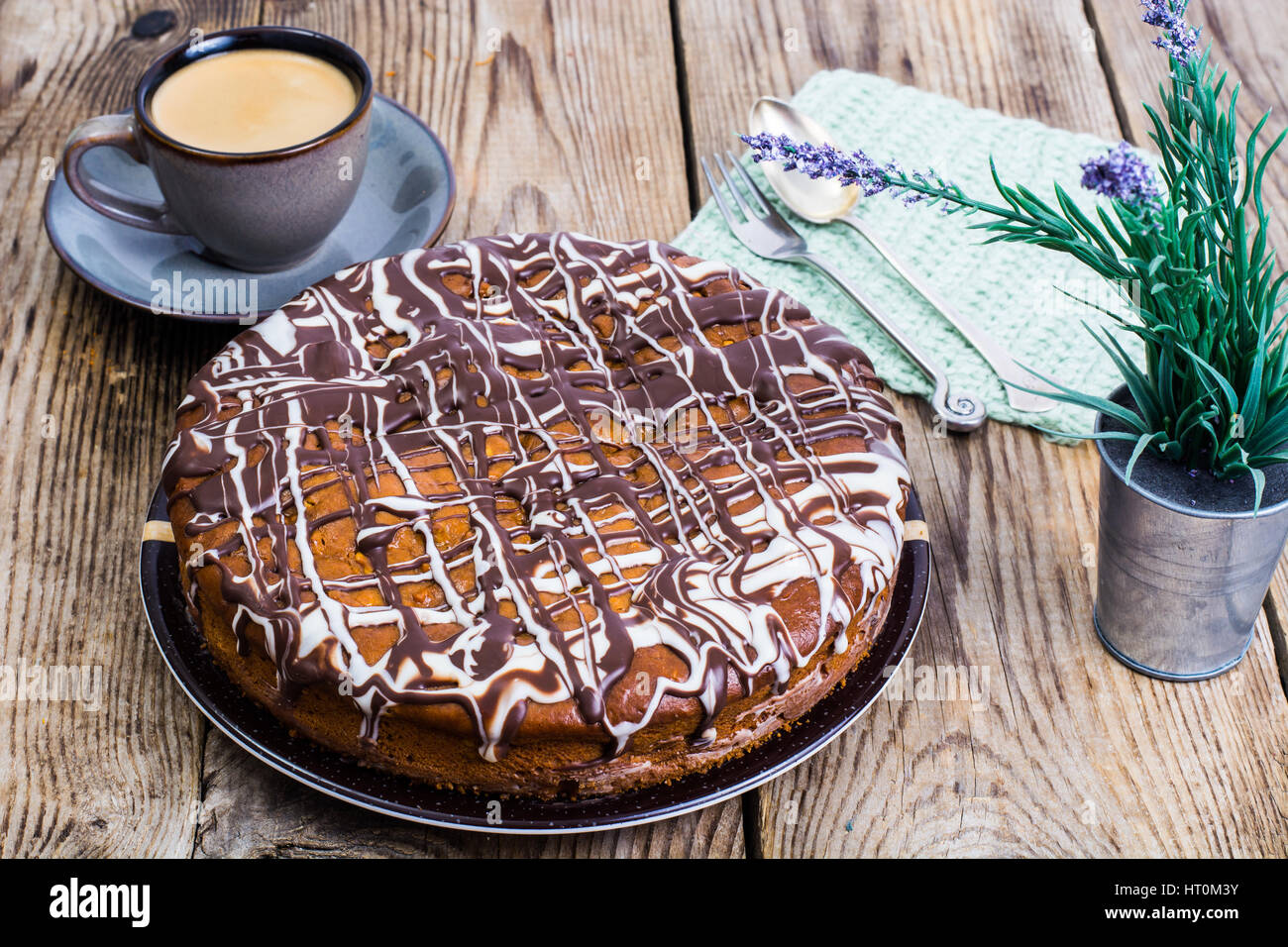 Sponge cake with icing of white and dark chocolate Stock Photo - Alamy