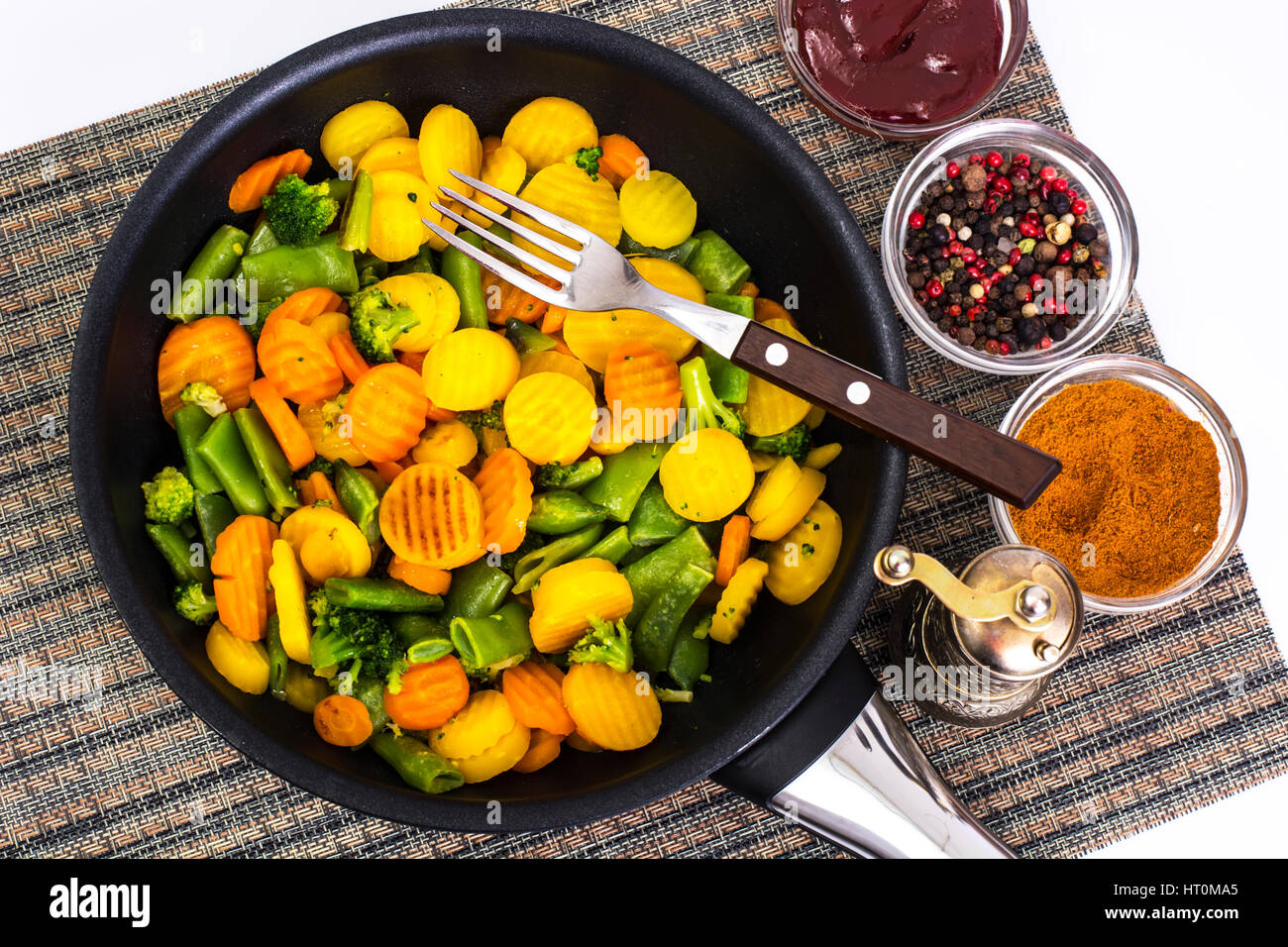 Vegetables in frying pan, top view Stock Photo - Alamy