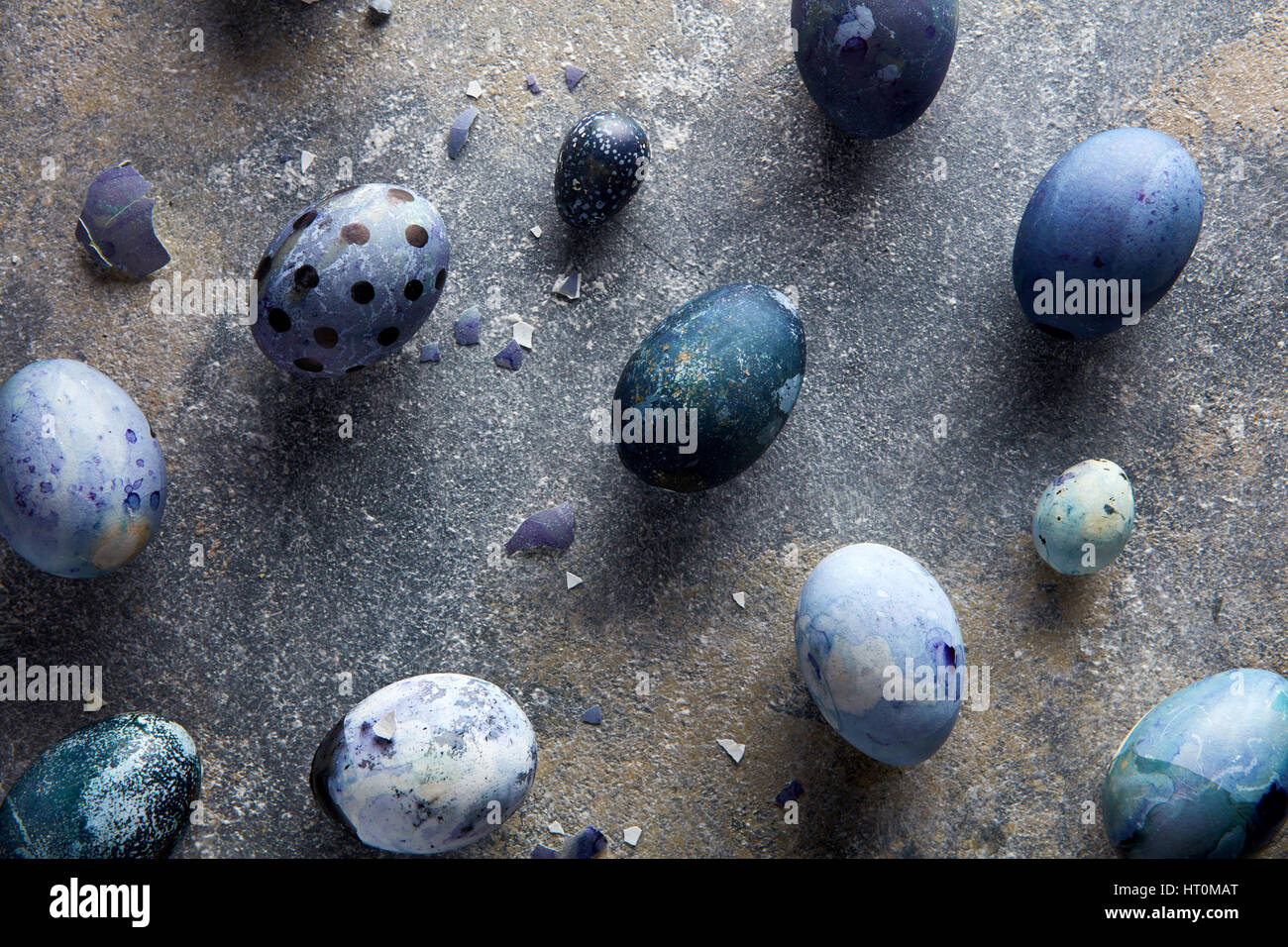 eggshells and blue eggs on a dark background as a Easter background ...