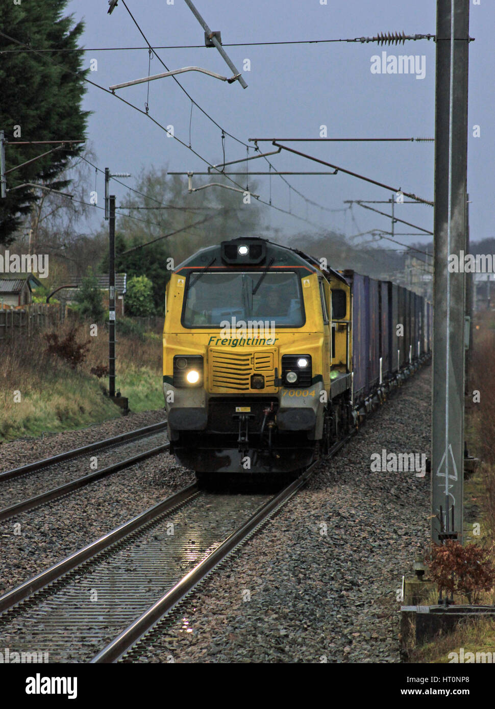 A Freightliner container train passes Euxton Balshaw Lane station near ...