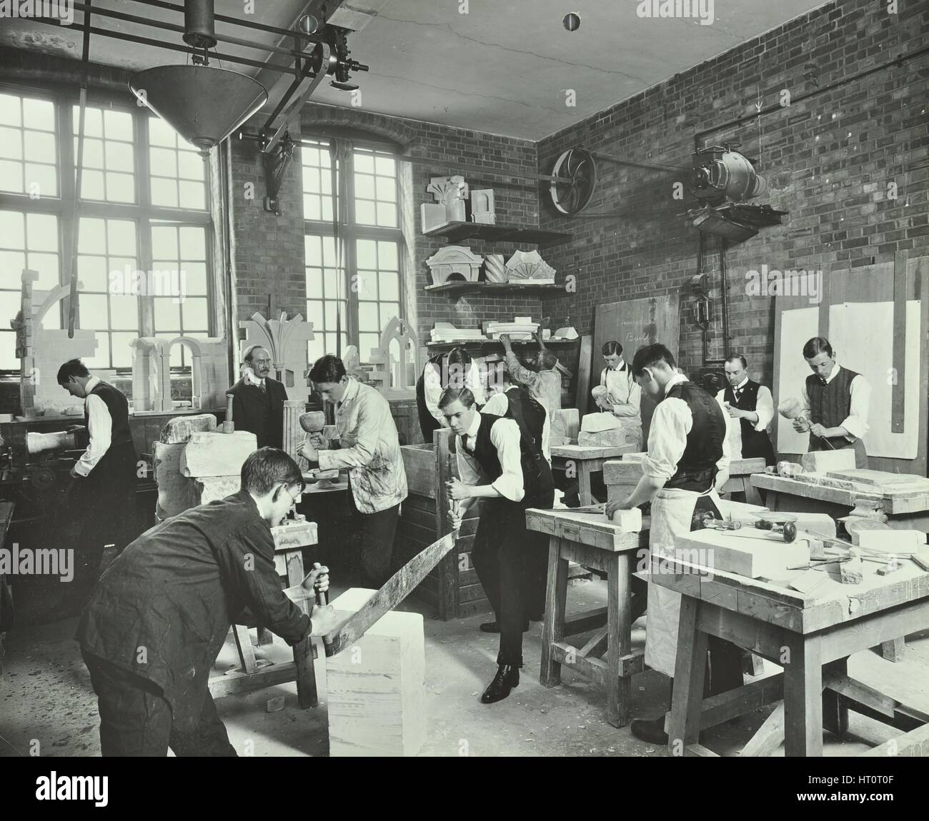 Male students at work in the Mason's Shop, Northern Polytechnic, London ...