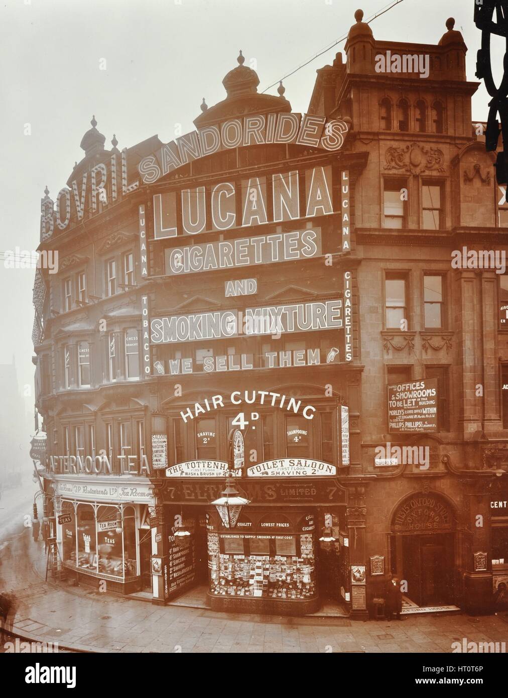 Illuminated advertisements on shop fronts at 7, Oxford Street, London ...