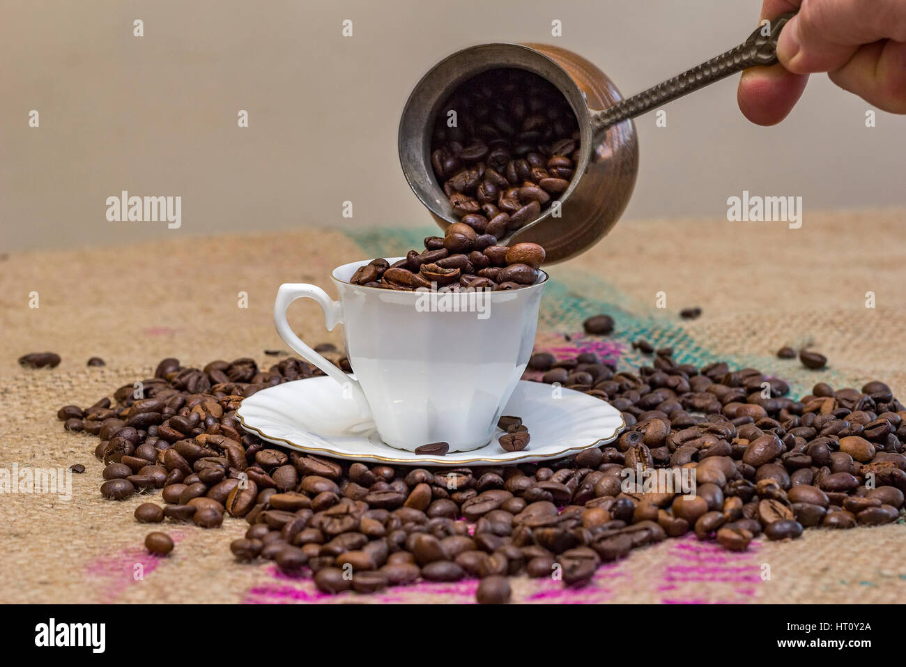 Abstract . Hand pouring coffee beans from coffee pot to cup Stock Photo ...