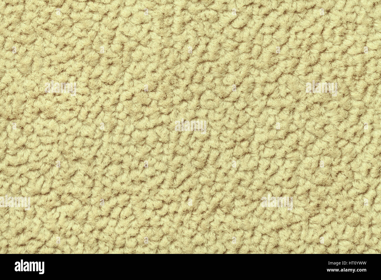 Light yellow fluffy background of soft, fleecy cloth. Texture of ...