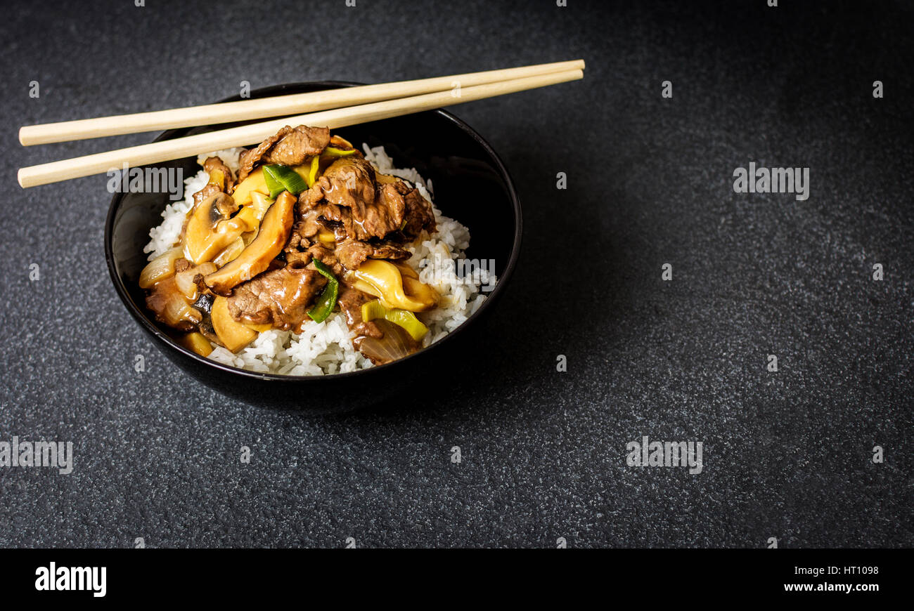 Chinese rice with beef meat and vegetagles on dark background Stock ...
