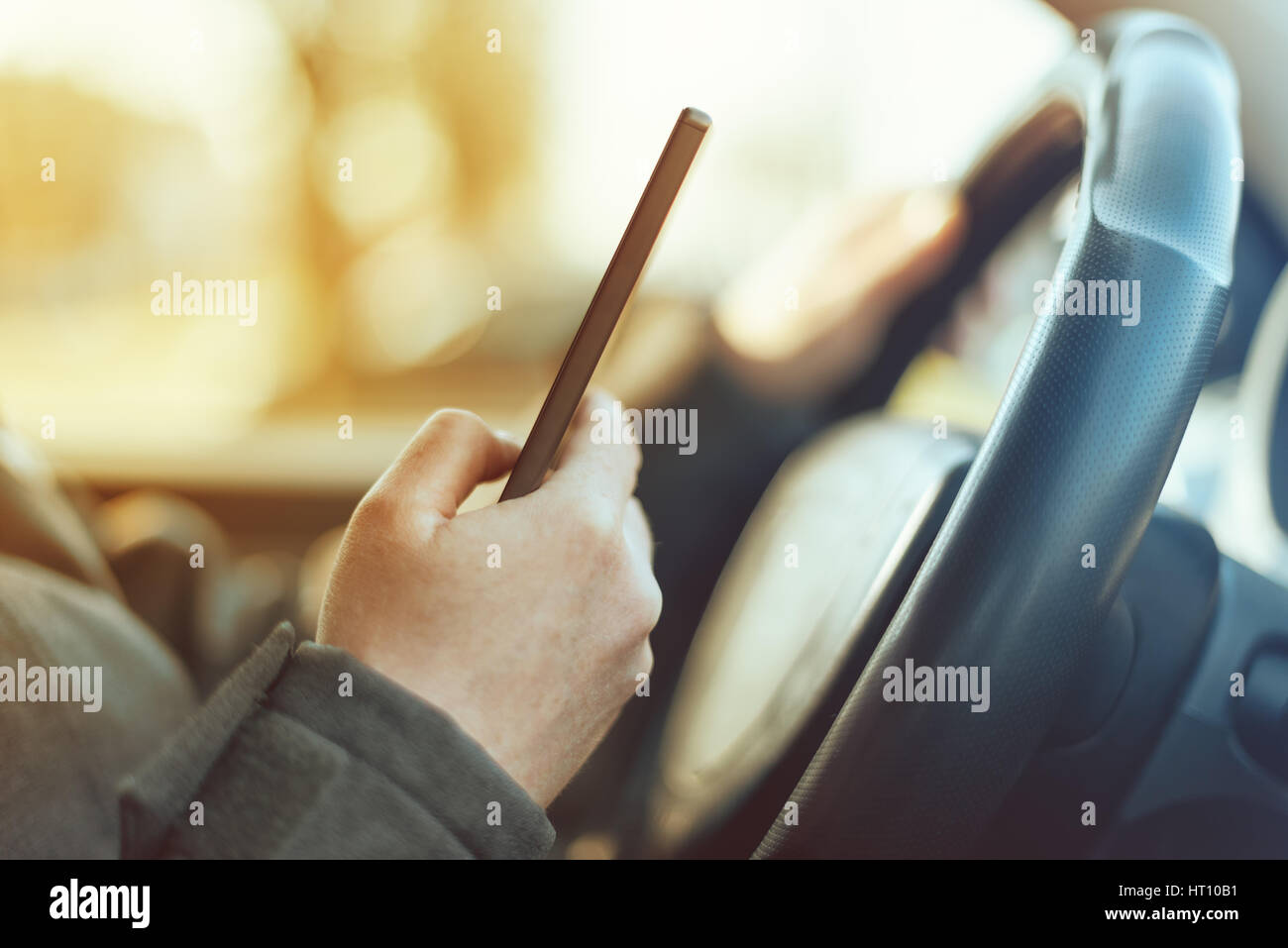 Driving car and using mobile phone to send text message is dangerous ...