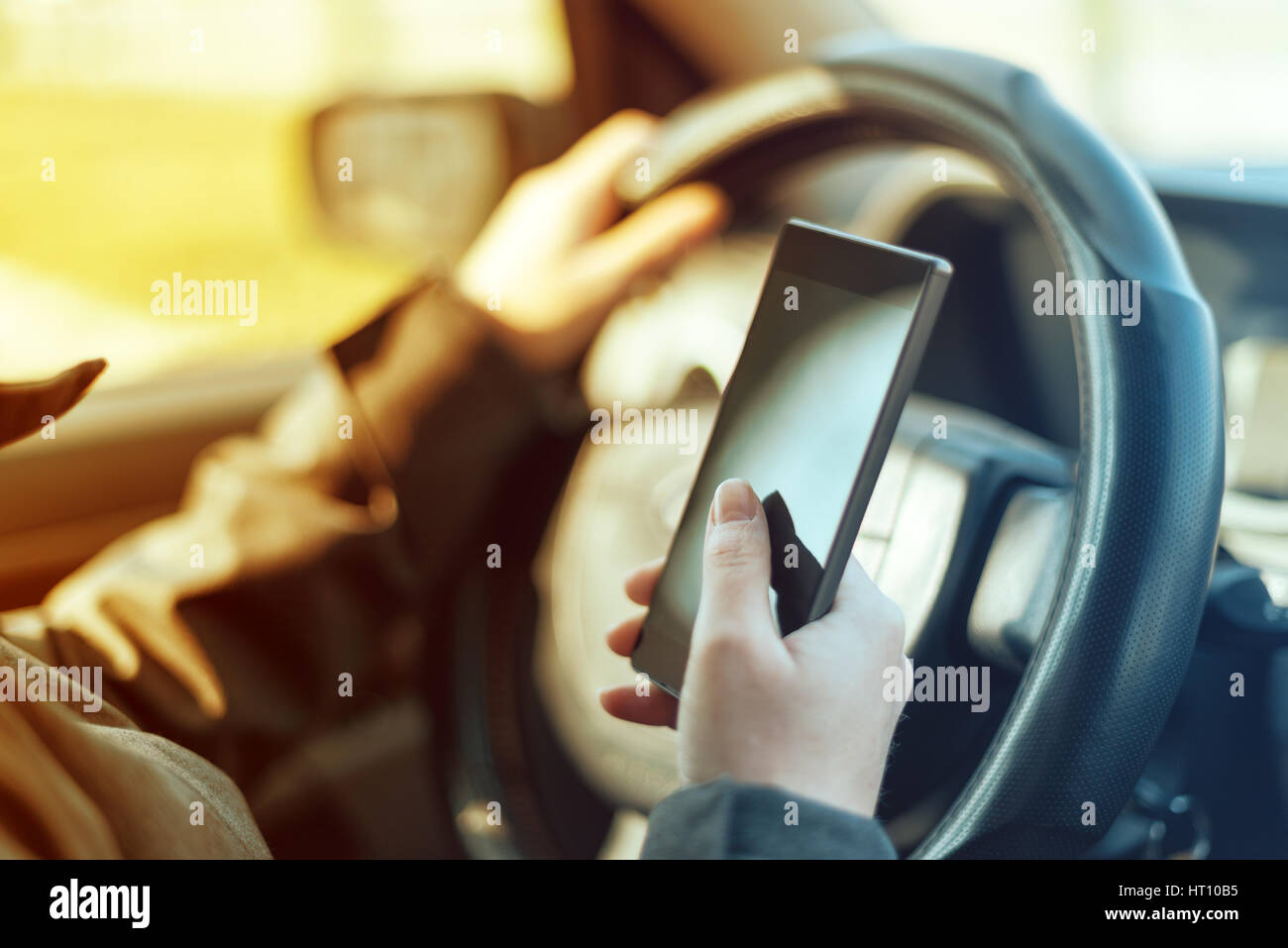 Driving car and using mobile phone to send text message is dangerous ...