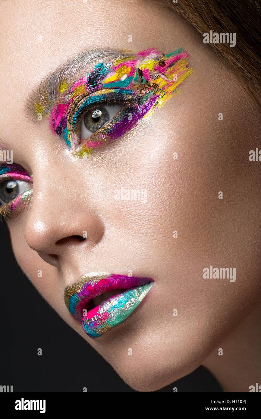 Beautiful girl with creative colorful makeup. Beauty face. Photos shot ...