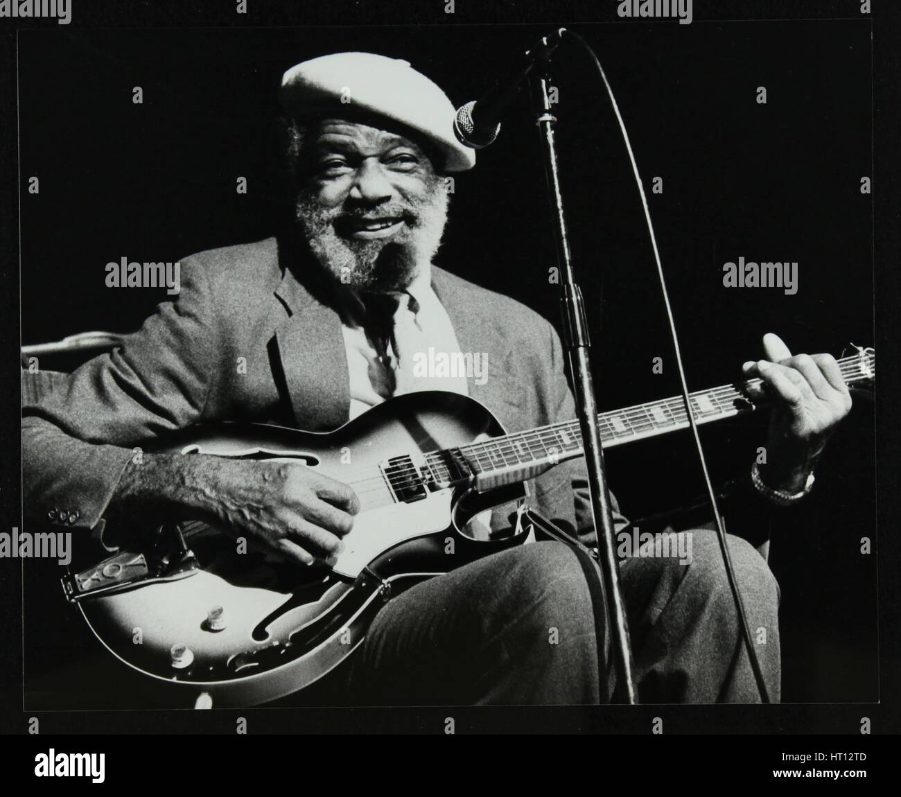 Slim Gaillard playing his guitar at the Forum Theatre, Hatfield ...