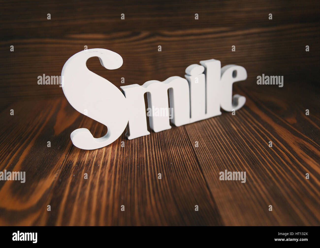 smile letters on wooden background. smile wooden word. place for text ...