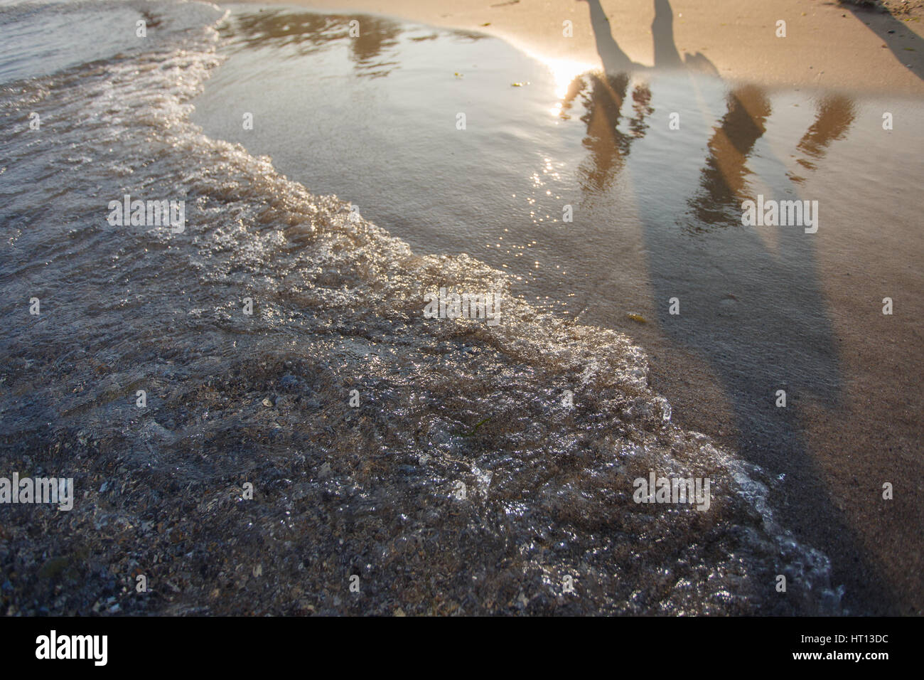 Sand beach and wave. summer time. Oceanic water Stock Photo - Alamy