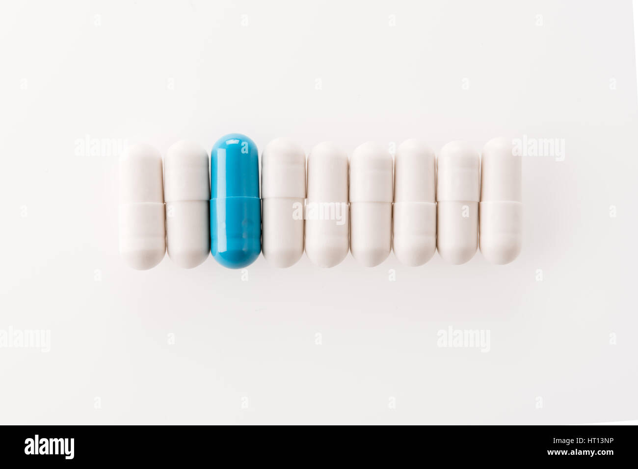 top view of medical capsules in row on white Stock Photo - Alamy