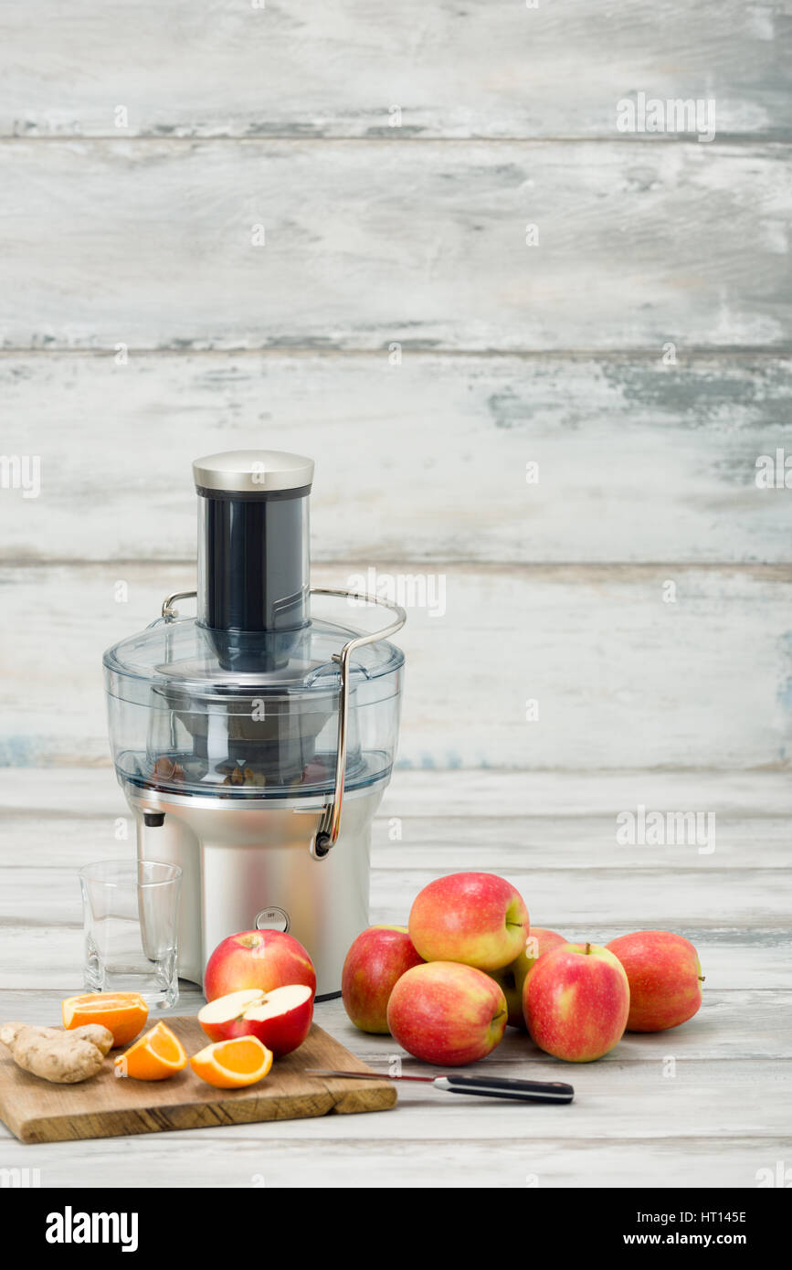 Modern electric juicer and various fruit on kitchen counter, healthy ...