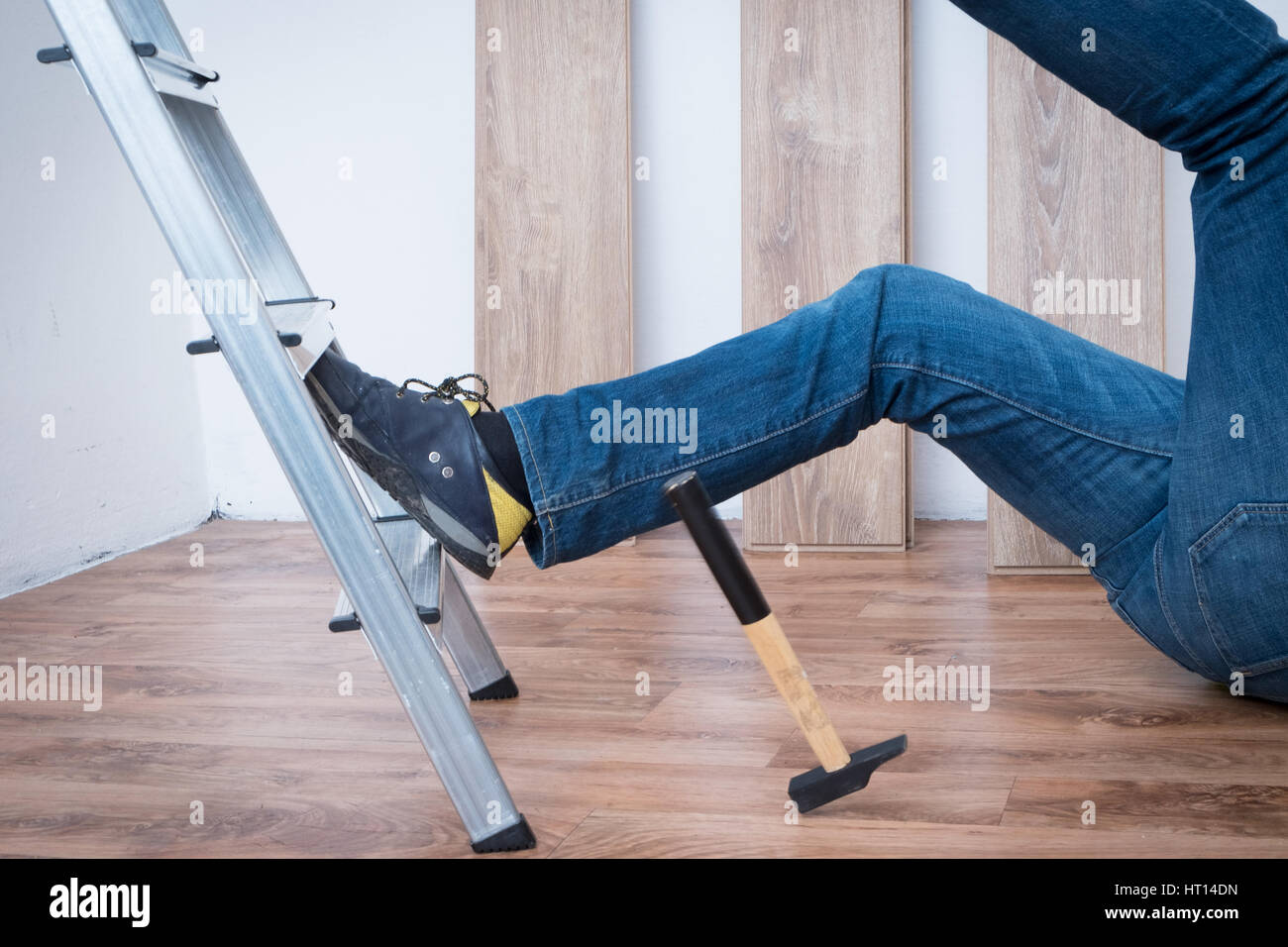 On the job injury of one worker fallen from a ladder Stock Photo - Alamy