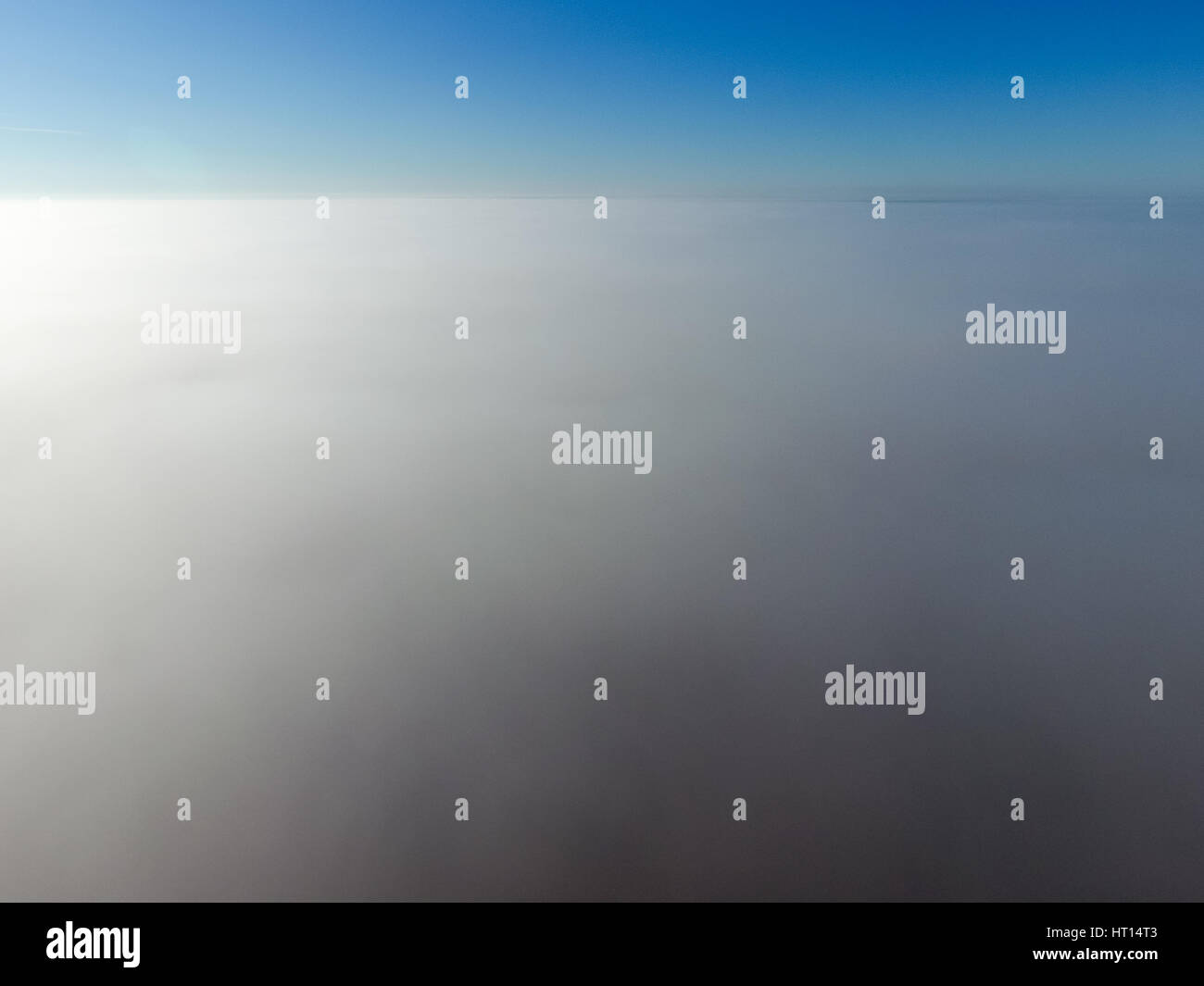 In the skies above the fog. Sunrise over the fog. Clouds near the ...