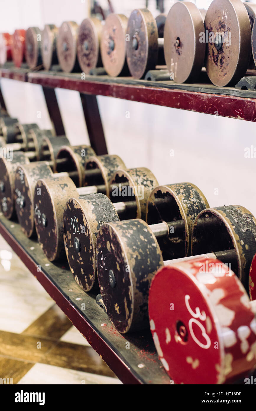 exercise weights - iron dumbbell in gym. iron dumbbells Stock Photo - Alamy