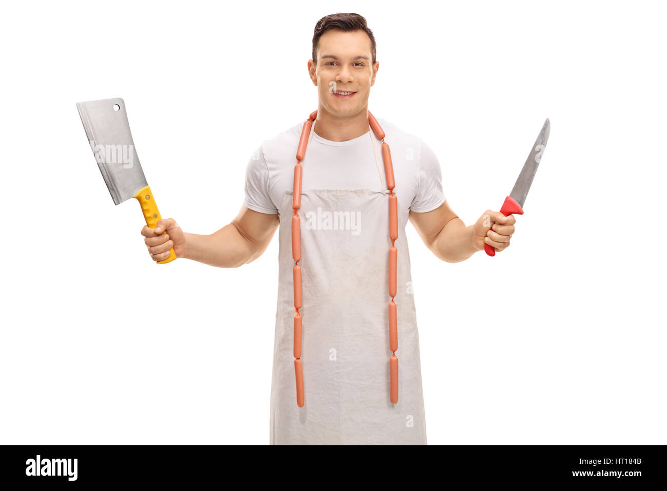 Young butcher with a cleaver and a knife isolated on white background ...