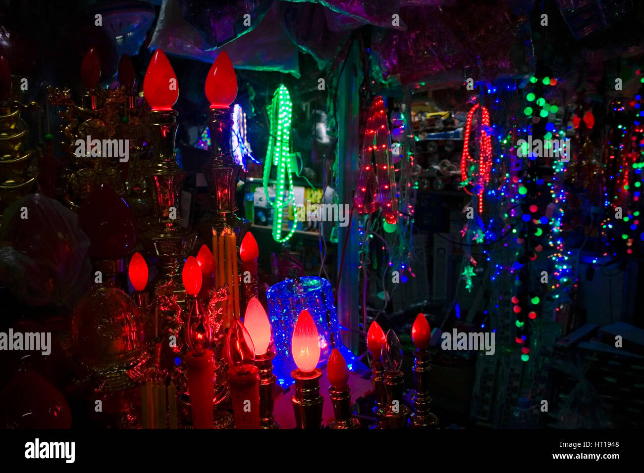 Bright colorful lights are displayed at a light store in Phnom Penh ...