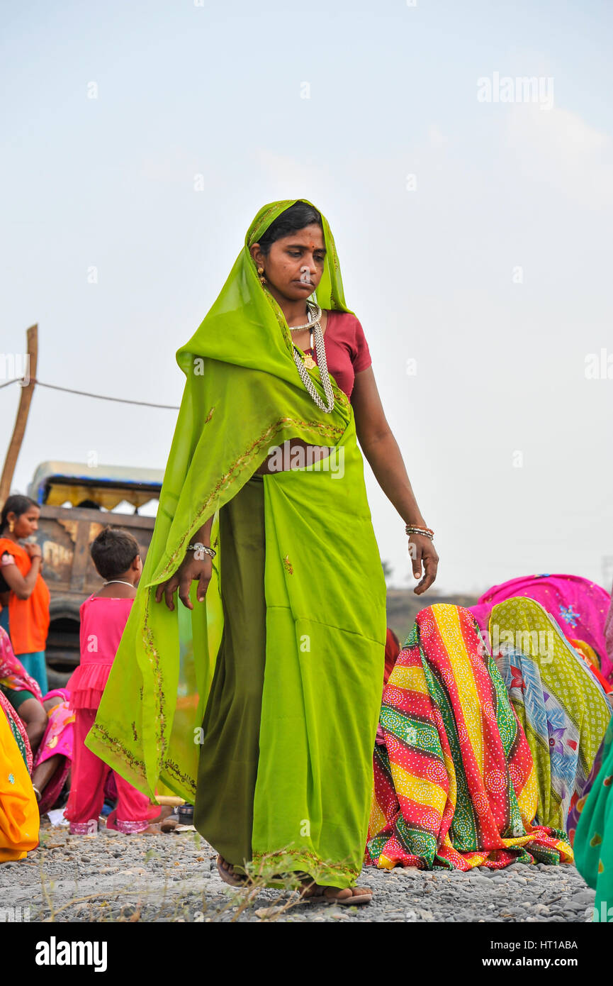 Rajasthani Bhil woman in a lime green sari Stock Photo - Alamy