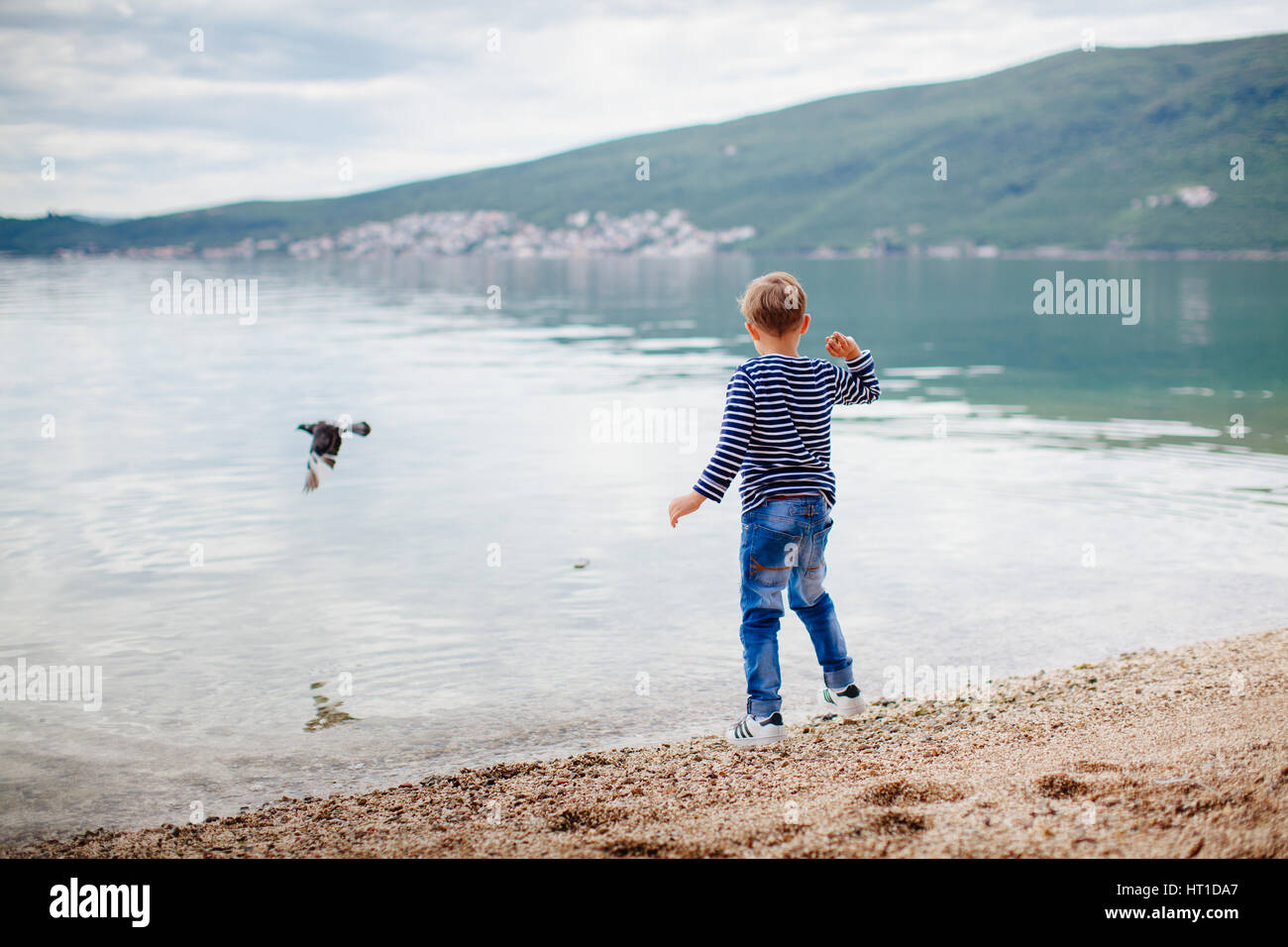 Boy throws stones hi-res stock photography and images - Alamy