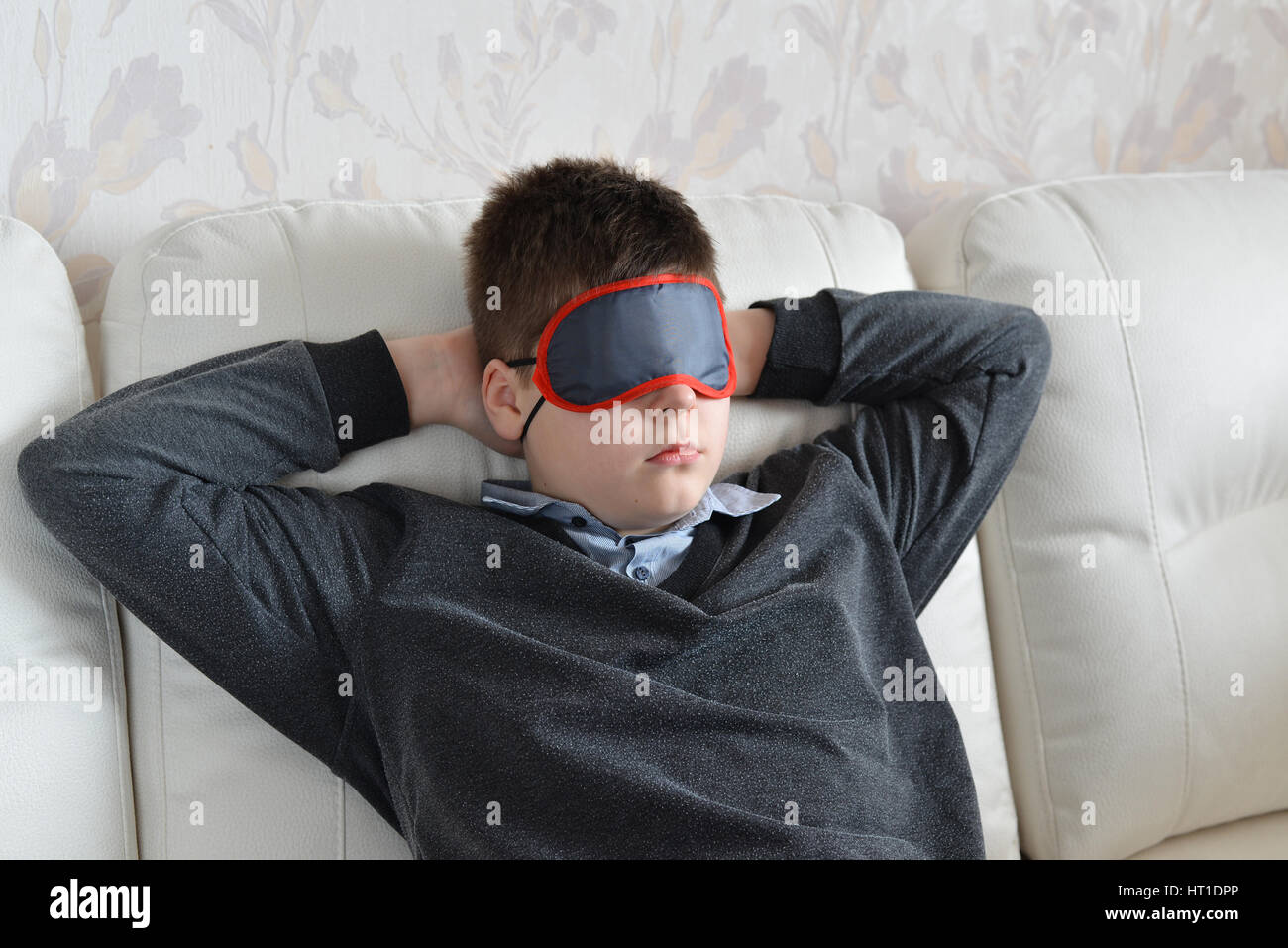 Teen rest during the day in mask for sleep Stock Photo - Alamy