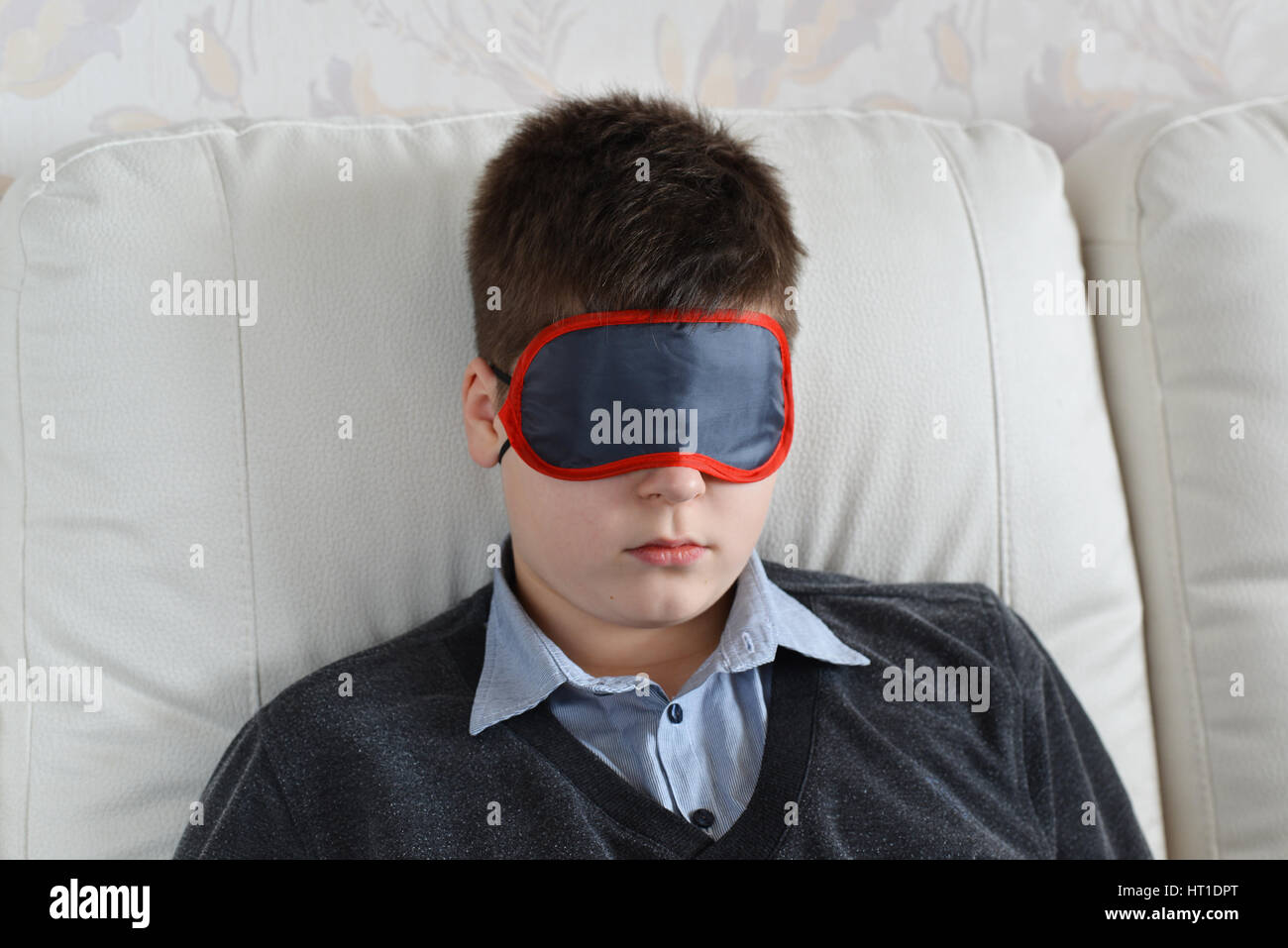 Teen rest during the day in mask for sleep Stock Photo - Alamy