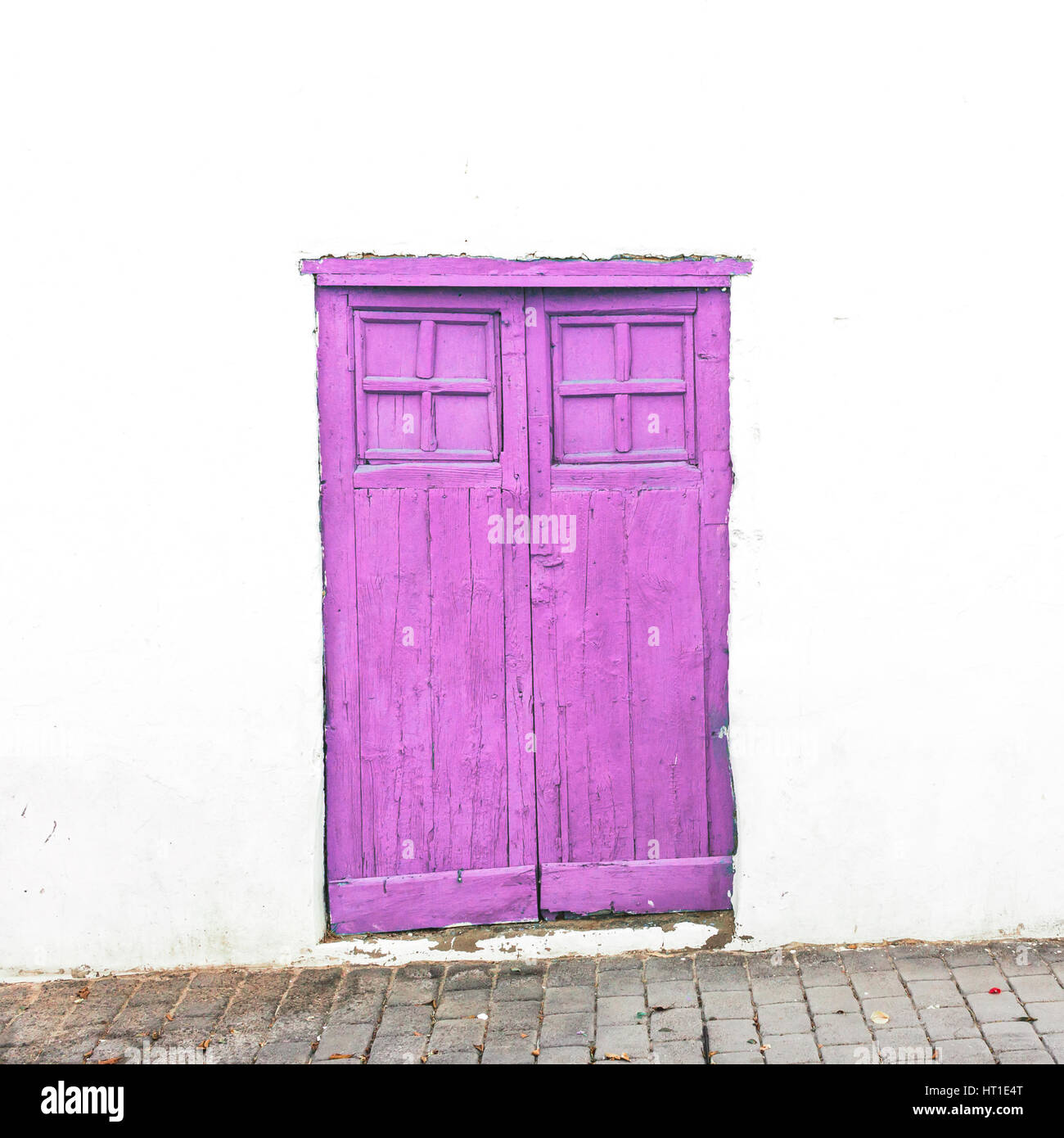 house white wall with violet door Stock Photo - Alamy