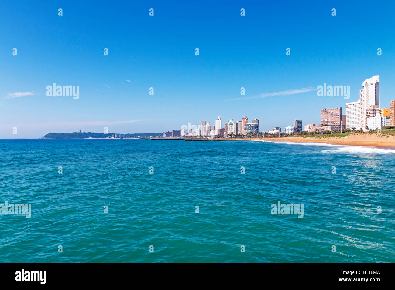 Coastal landscape with beach ocean blue sky and city skyline in Durban ...