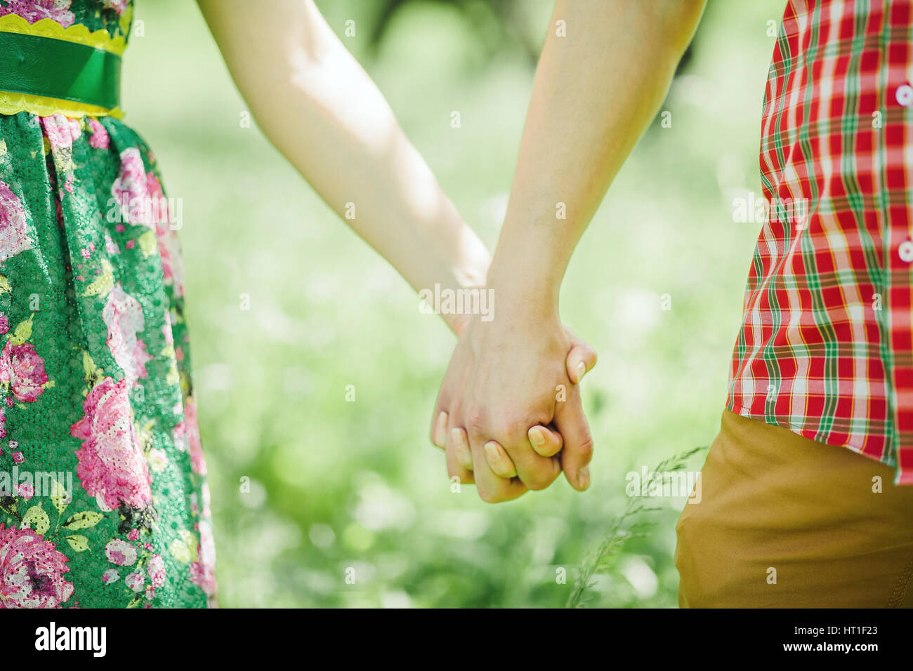 lovely couple holding hands together. Close up shot Stock Photo - Alamy